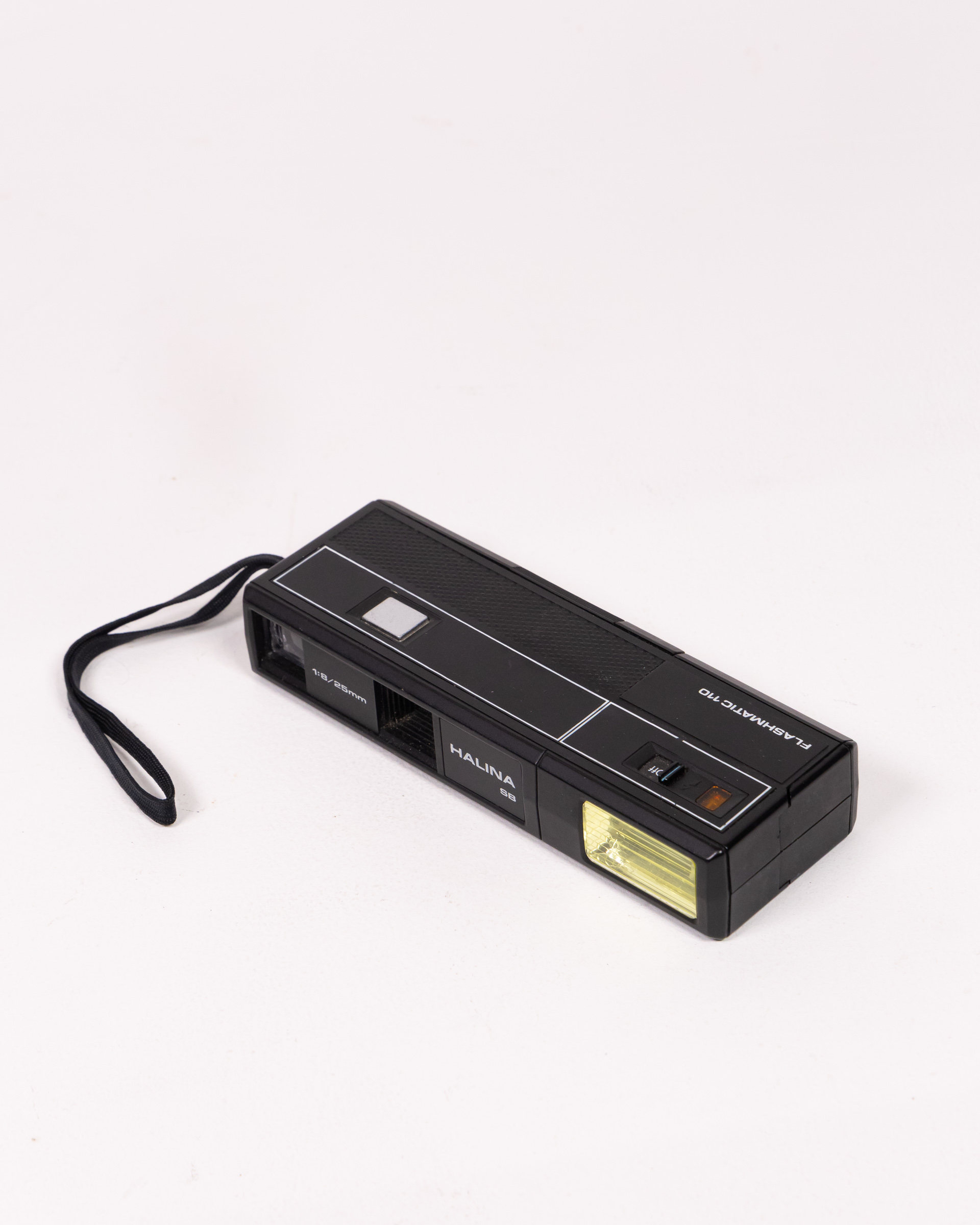 Vintage Halina Flashmatic 110 Camera with Wrist Strap - On The Square ...